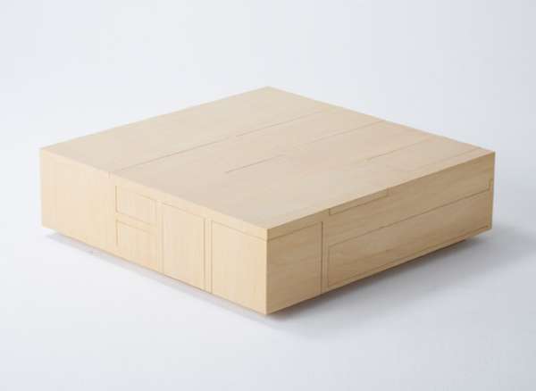 Kai Table functions as a coffee table while offering built-in storage ...